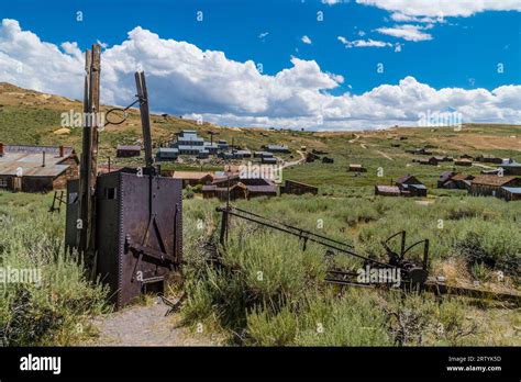 old neglected mining equipment in a field at the bodie ghost town in