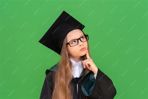 Premium Photo A Beautiful Schoolgirl In A Graduation Cap And A
