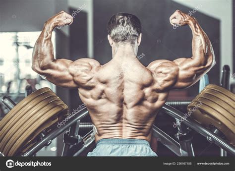 Brutal Strong Bodybuilder Athletic Aged Man Pumping Muscles Workout