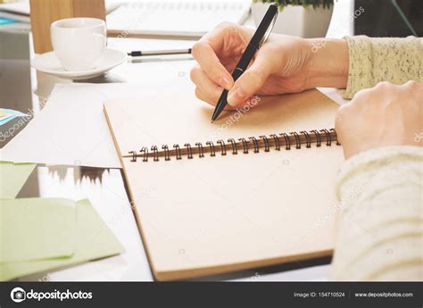 Woman Writing In Notepad Side Stock Photo Peshkova 154710524