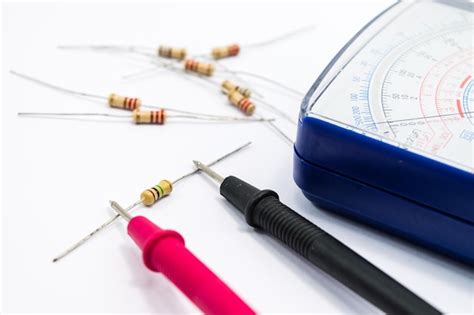 Premium Photo Close Up Of Multimeters By Resistors Against White