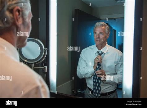 Men Adjusting Tie In Mirror High Resolution Stock Photography And