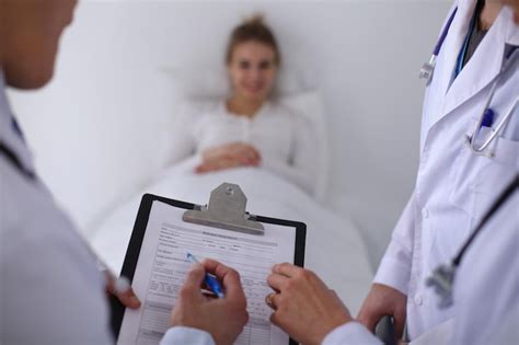 Premium Photo Close Up Of Medical History Patient In The Background