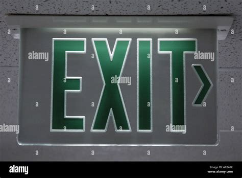 Green Illuminated Exit Sign Stock Photo Alamy