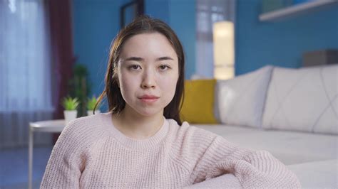 Unhappy Asian Young Woman Looking At Camera With Frustration 42543487