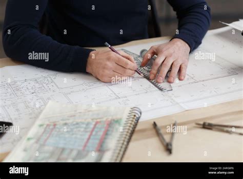 Architect Working In Office With Blueprintsengineer Inspect Architectural Plan Sketching A
