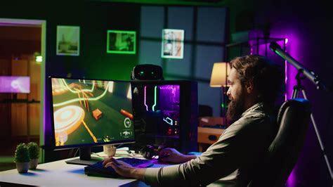 Man In Dark Living Room Playing Science Fiction Videogame On Gaming Pc