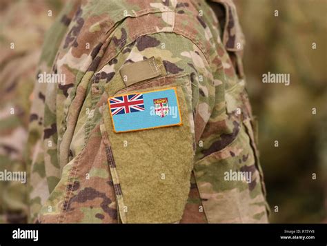 Flag Of Fiji On Soldiers Arm Flag Of Fiji On Military Uniforms