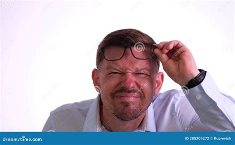 Man With Poor Eyesight And Glasses On White Background Stock Footage