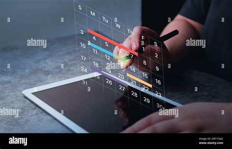 Woman Use Digital Tablet To Mark Dates On Virtual Hologram Calendar