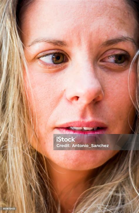 Portrait Of The Face Of A Beautiful Blond Woman On White Background