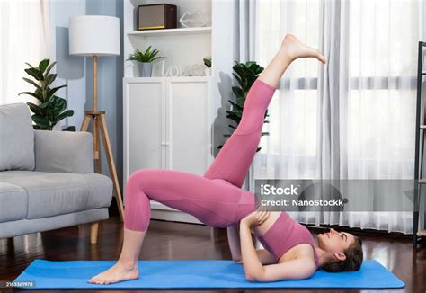 Flexible And Dexterity Woman In Sportswear Doing Reverse Gaiety Yoga