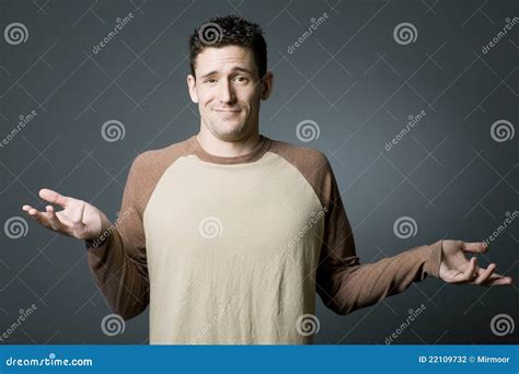 Handsome Man Makes A Pointing Gesture Stock Photo Image Of Fashion Jeans 22109732