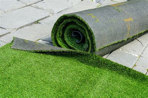 Preparing Artificial Grass Carpet Rolls For Outdoor Event Flooring In
