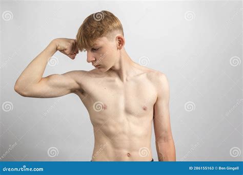 Teenage Boy Flexing His Bicep Stock Image Image Of Teenage Healthy