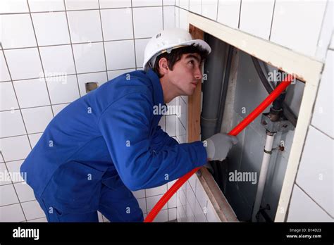 Man Fixing Plumbing Stock Photo Alamy