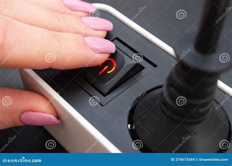 Female S Hand Pressing The Power Button On Multiple Socket Outlet Stock Photo Image Of