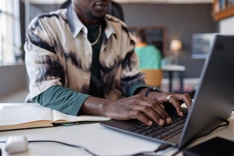 Premium Photo Closeup Of African American Programmer Typing On Laptop In Office
