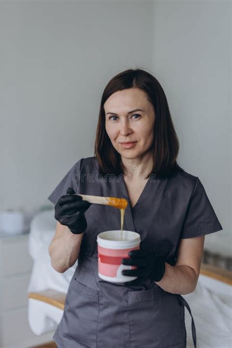 Depilation Master Shows Shugaring Depilation Spatulas In His Hands Stock Image Image Of