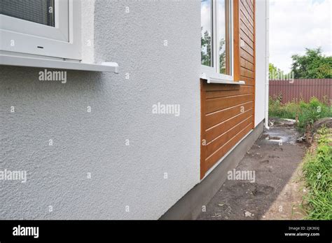 Modern House Facade Insulation Under Plastering Stucco And Wood Wall