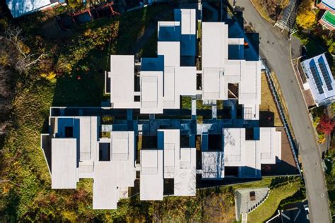 Kengo Kuma And Associates Nestles Staggered Housing Complex On Japanese Hillside