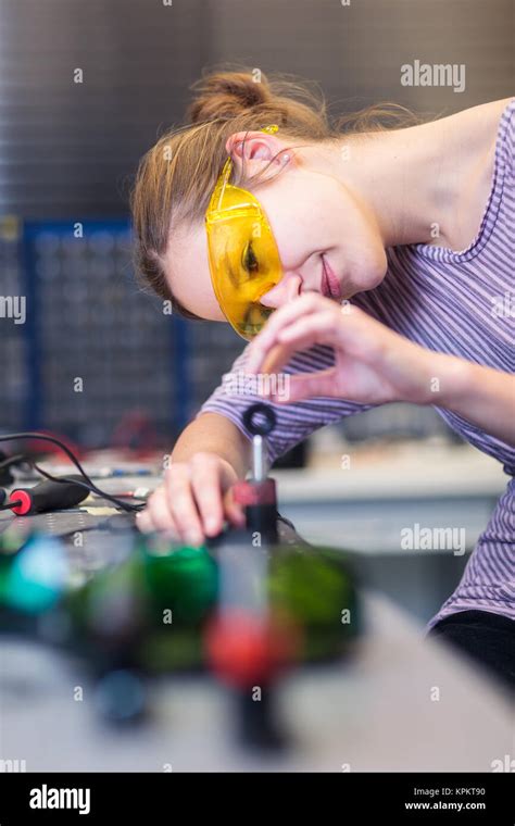 Female Scientist Carrying Out Research Experiments In A Quantum Optics Lab Color Toned Image