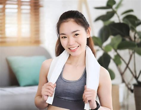 Premium Photo Asian Fitness Girl Smiling After Doing Exercises At Home