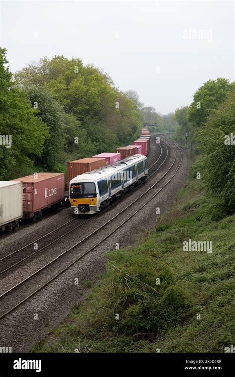 Chiltern Railways Class 165 Diesel Passing A Freightliner Train In Hatton Down Loop Line