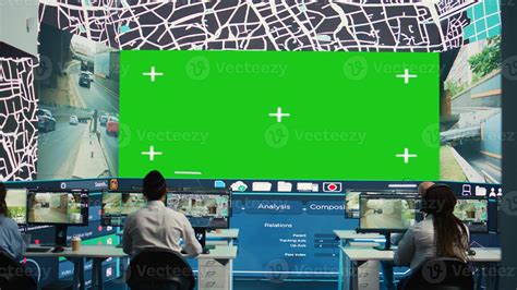 Shipping Agency Workers Examine Satellite Map With Huge Greenscreen