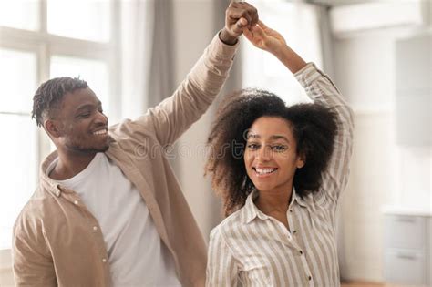 Happy African American Married Couple Enjoying Romantic Weekend Dance