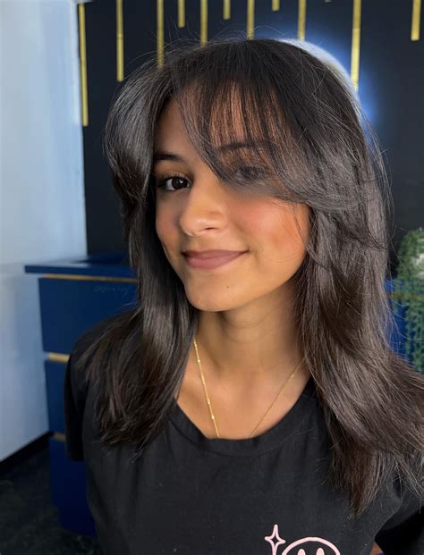 26 Butterfly Haircuts With Bangs That Give That Soft Bouncy Look