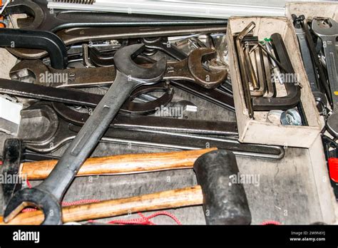 Wooden Tool Box Of Hand Tools With Old And Dirty Rusty Wrenches Ring Spanners Pliers