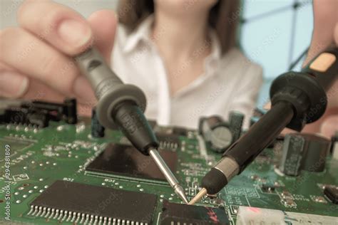 Girl With Measuring Devices In The Electronics Laboratory Stock Photo Adobe Stock