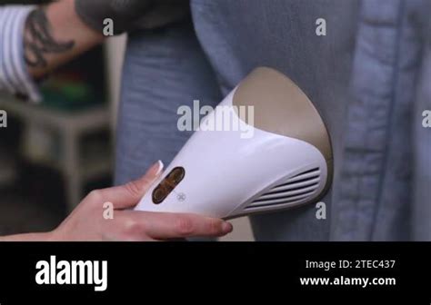 Beautiful Housewife Irons Her Shirt Inside The House With A Steamer Laundry And Dry Cleaning