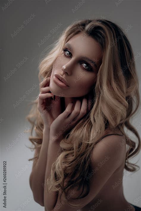 Beautiful Sexy Blonde Girl Posing Topless In A Studio In Black Pantyhose Advertising Space