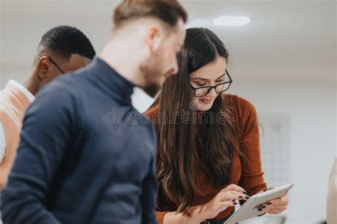 Diverse Team Collaborating For Business Growth Analyzing Reports Discussing Strategies And