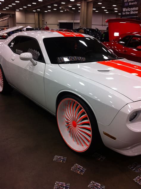 White Sports Car With Red Stripes At Car Showroom