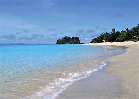 Fiji Beach With Clear Blue Water And White Clouds