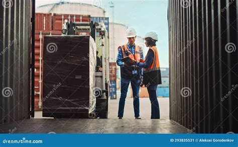 Forklift Driver Loading Shipping Cargo Container With Full Pallet With Boxes In Logistics Port