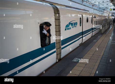 Japan Train Conductor Checking Platform In A N700 Nozomi Shinkansen