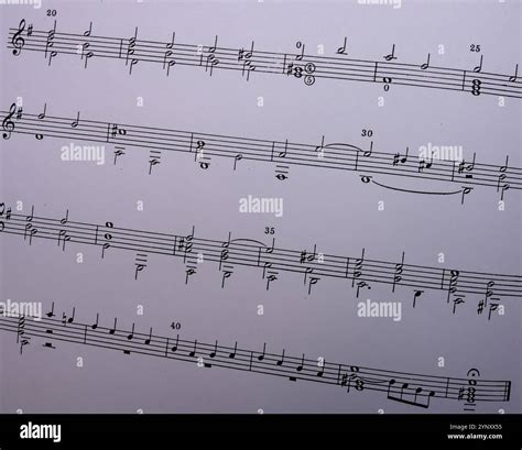 Sheet Music Is Laid Out On A Flat Surface Showcasing Musical Notes And Notation That Musicians