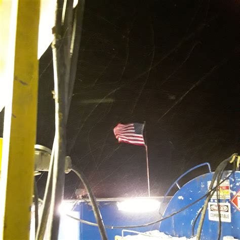 American Flag Flying At Gas Station