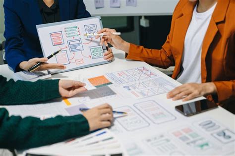 Ux Developer And Ui Designer Brainstorming About Mobile App Interface