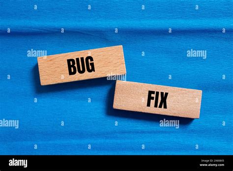 Bug Fix Words Written On Wooden Blocks With Blue Background Conceptual Bug Fix Symbol Copy
