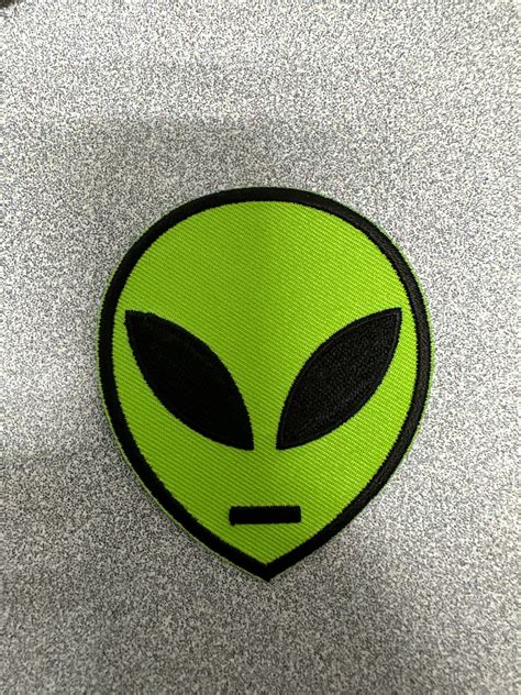 Green Alien Head Logo