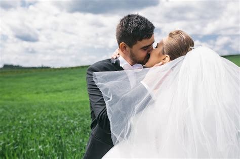 Married Couple Giving A Passionate Kiss Outdoors Photo Free Download