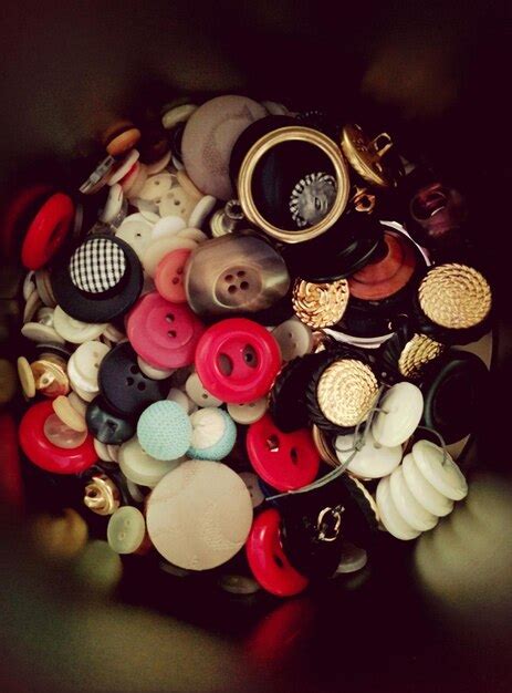 Premium Photo High Angle View Of Sewing Buttons In Container