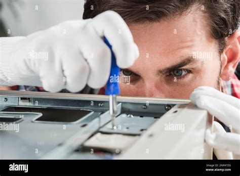 Male Technician Repairing Cpu Screwdriver High Resolution Photo Stock Photo Alamy