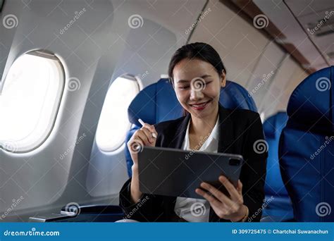Young Asian Executives Are First Class Multitask With Digital Tablets