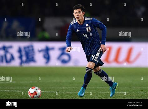 Shogo Taniguchi Of Japan Dribbles Against North Korean During The Eaff